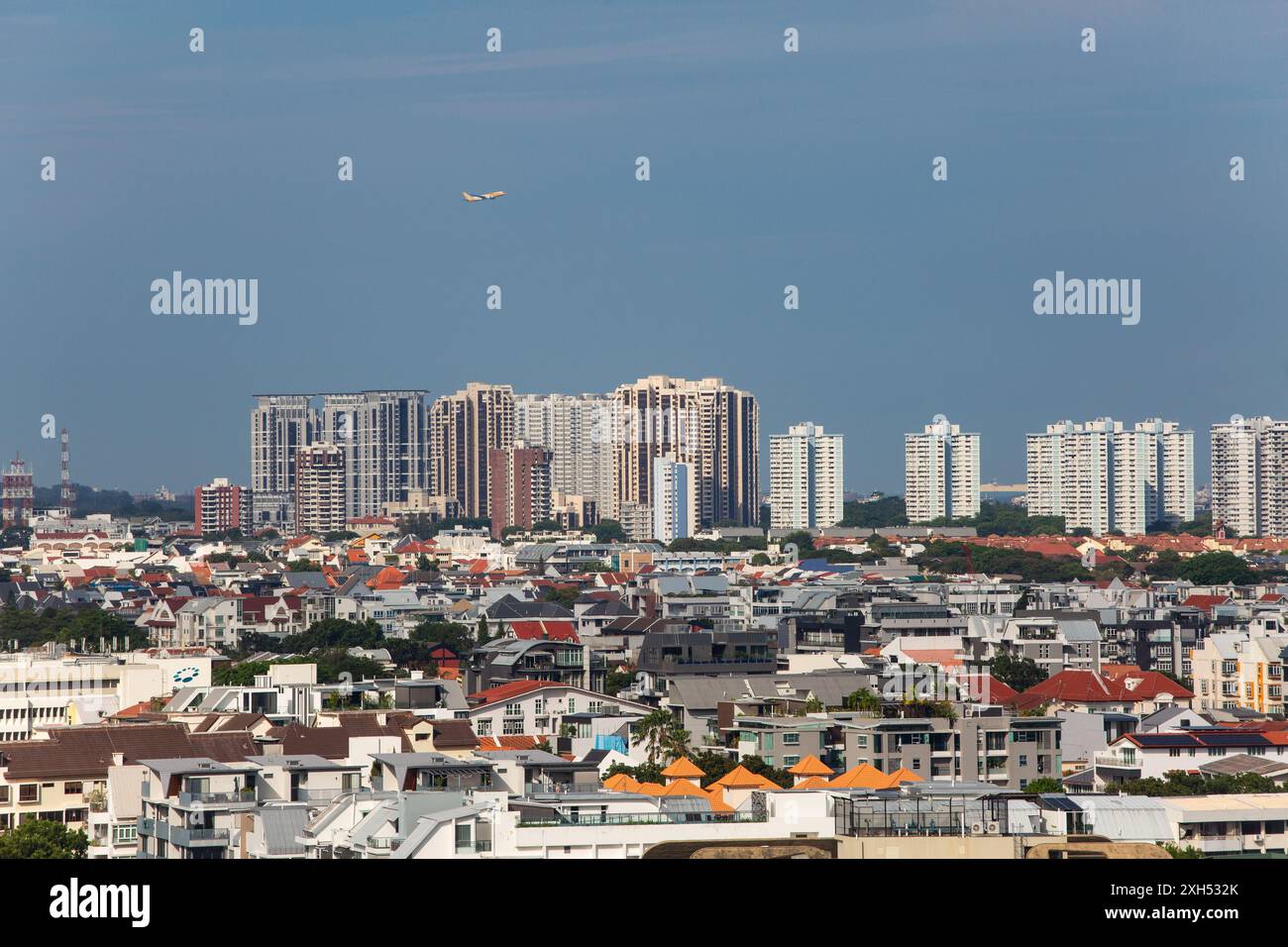 View of a commercial airline took off from Changi Airport, Foreground is Joo Chiat private ...