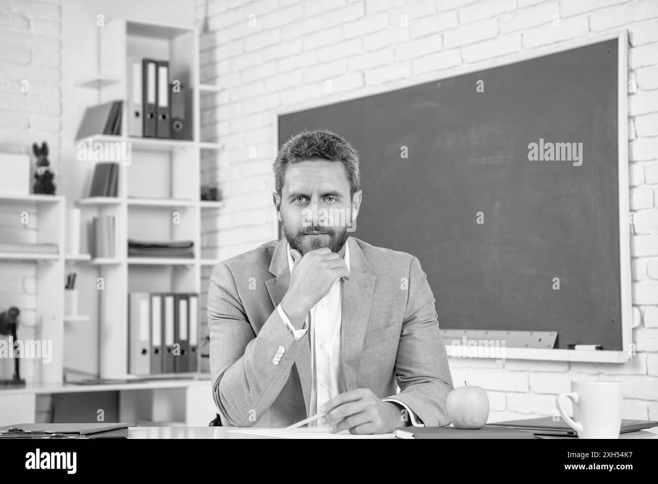 Serious mature teacher in Black and White Stock Photos & Images - Alamy