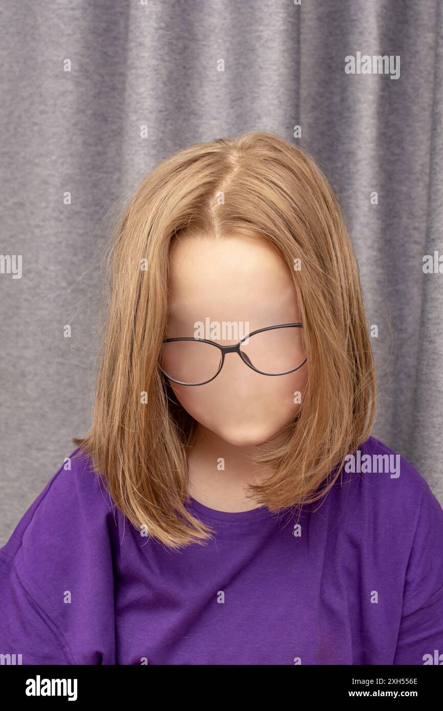 Unrecognizable blonde hair girl with erased face, abstract blurred skin ...