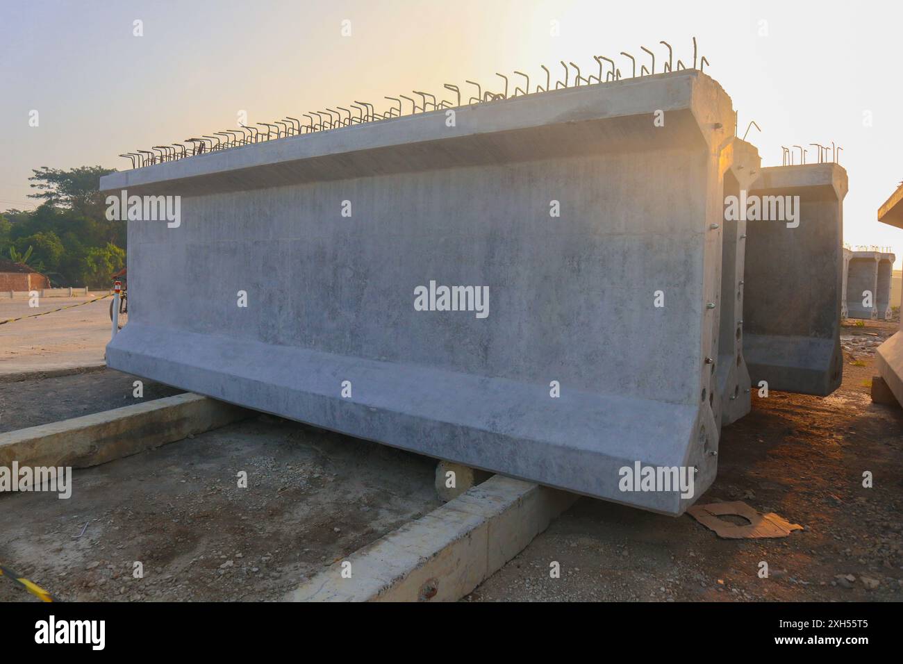 Prestressed concrete or Three gray concrete blocks are stacked on top ...