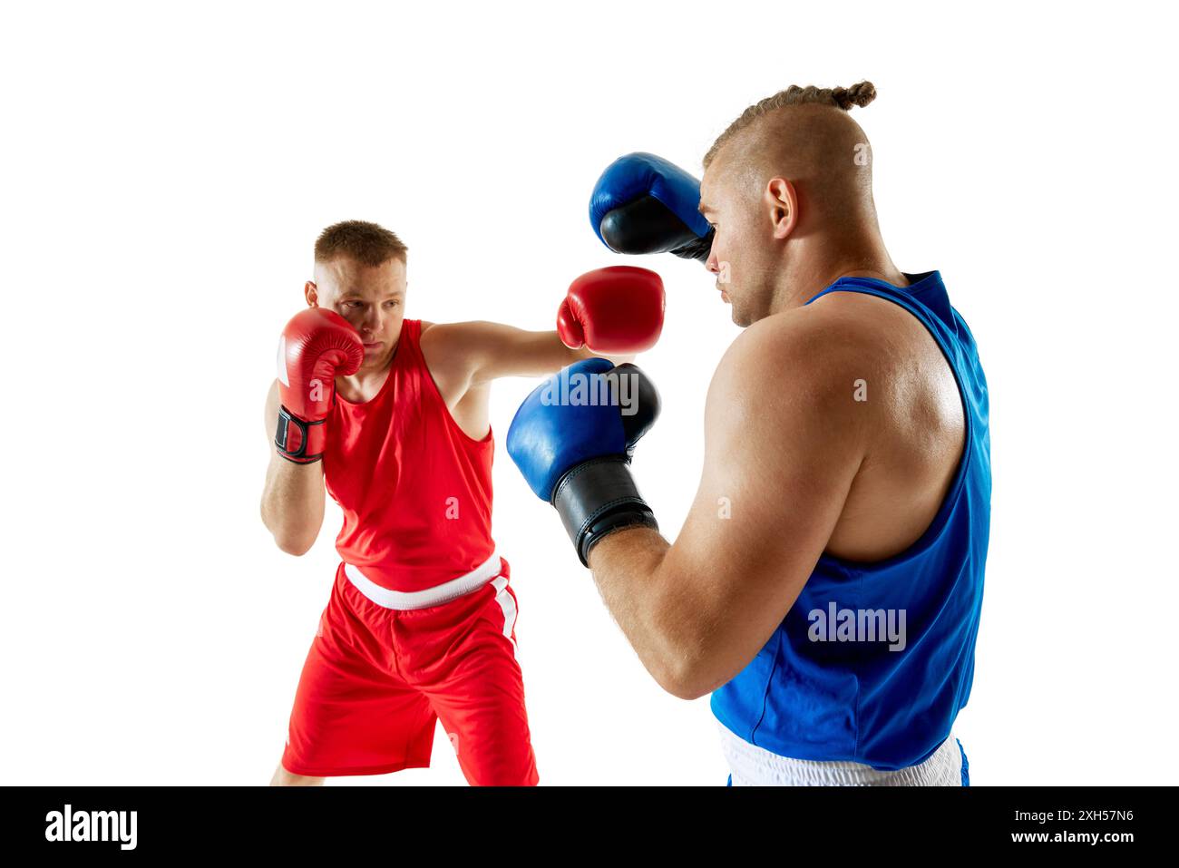 Two boxers in bout, one dressed in red and other in blue, each ...