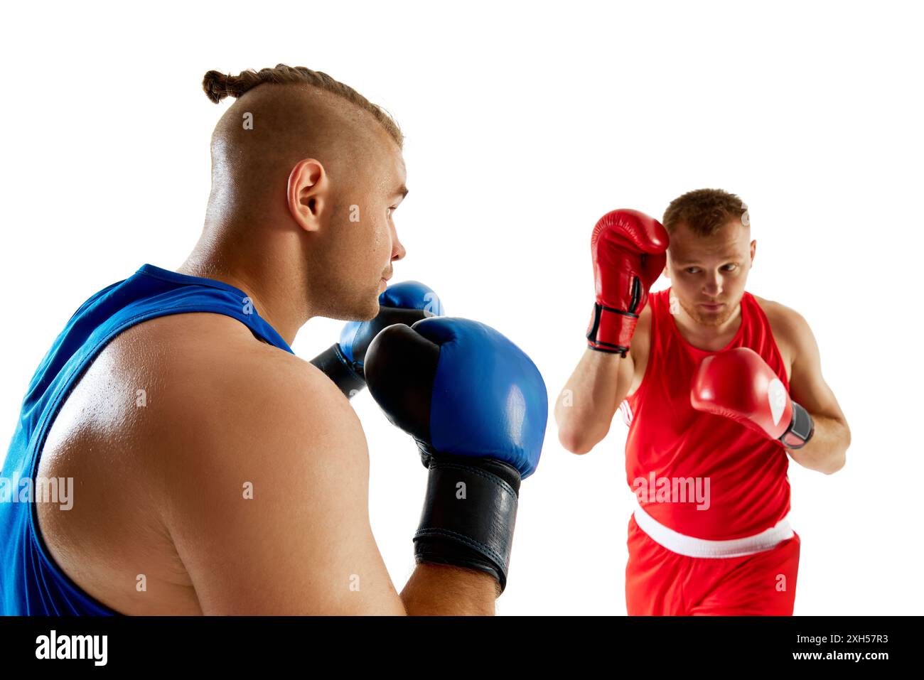 Two combat athletes engaged in sparring session, red competitor against ...