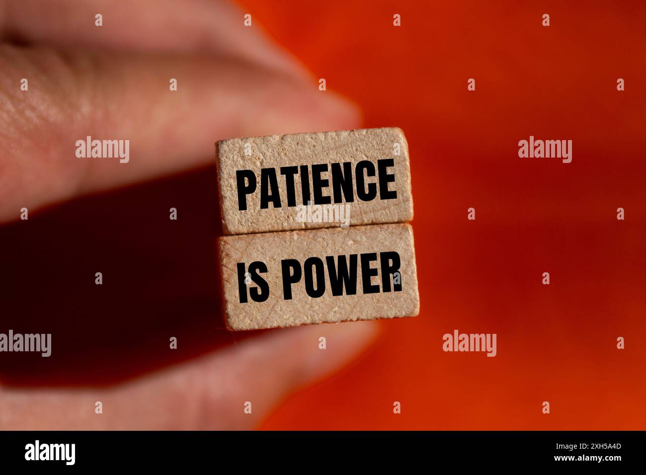 Patience is power message written on wooden blocks with orange ...