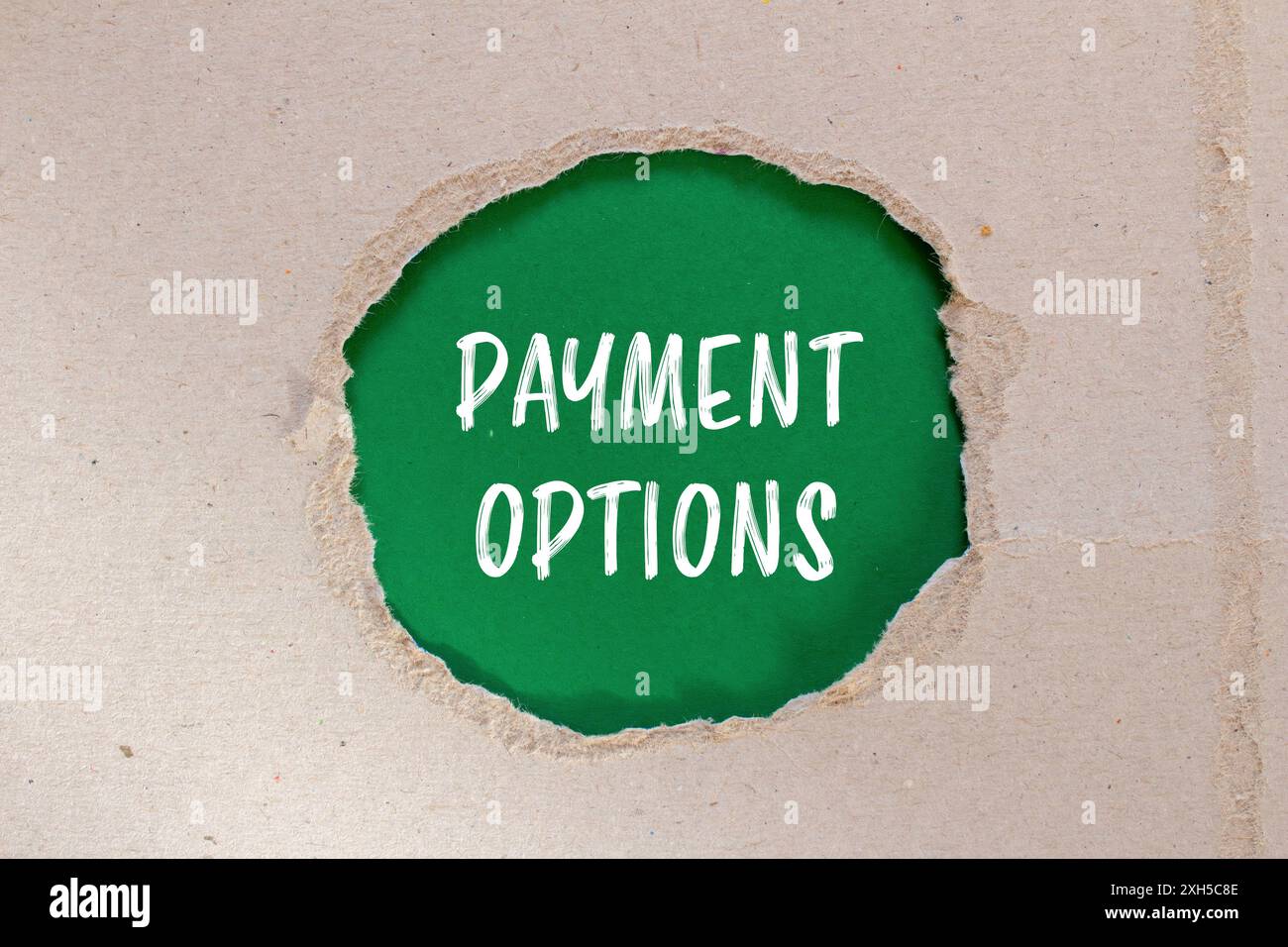 Payment options message written on ripped torn paper with green ...