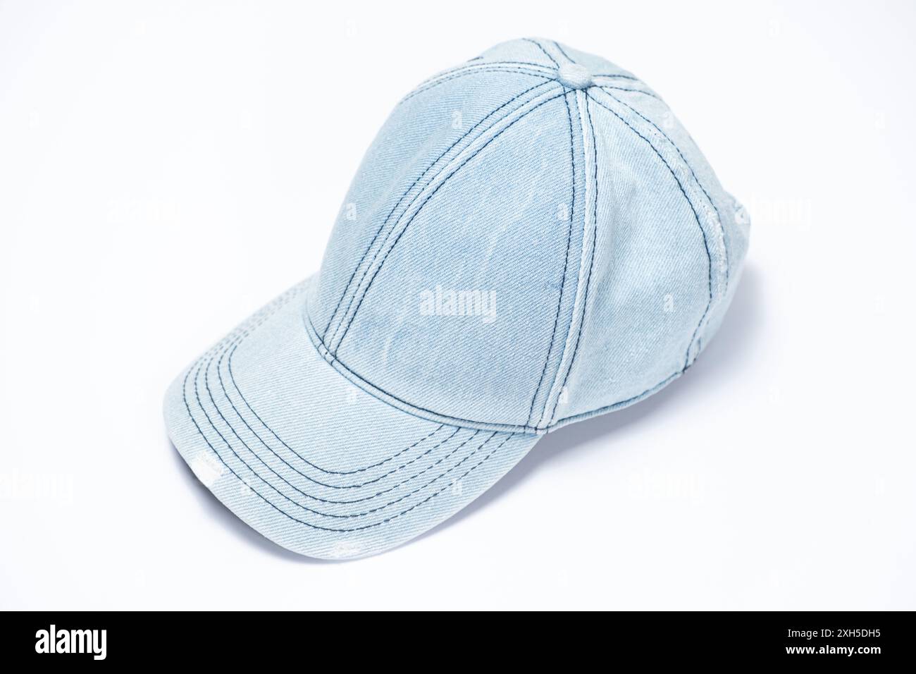 Blue denim cap close-up on white background Stock Photo - Alamy