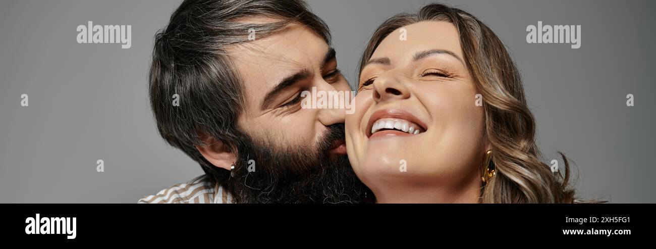 A couple in elegant attire shares a tender moment, the woman laughing ...