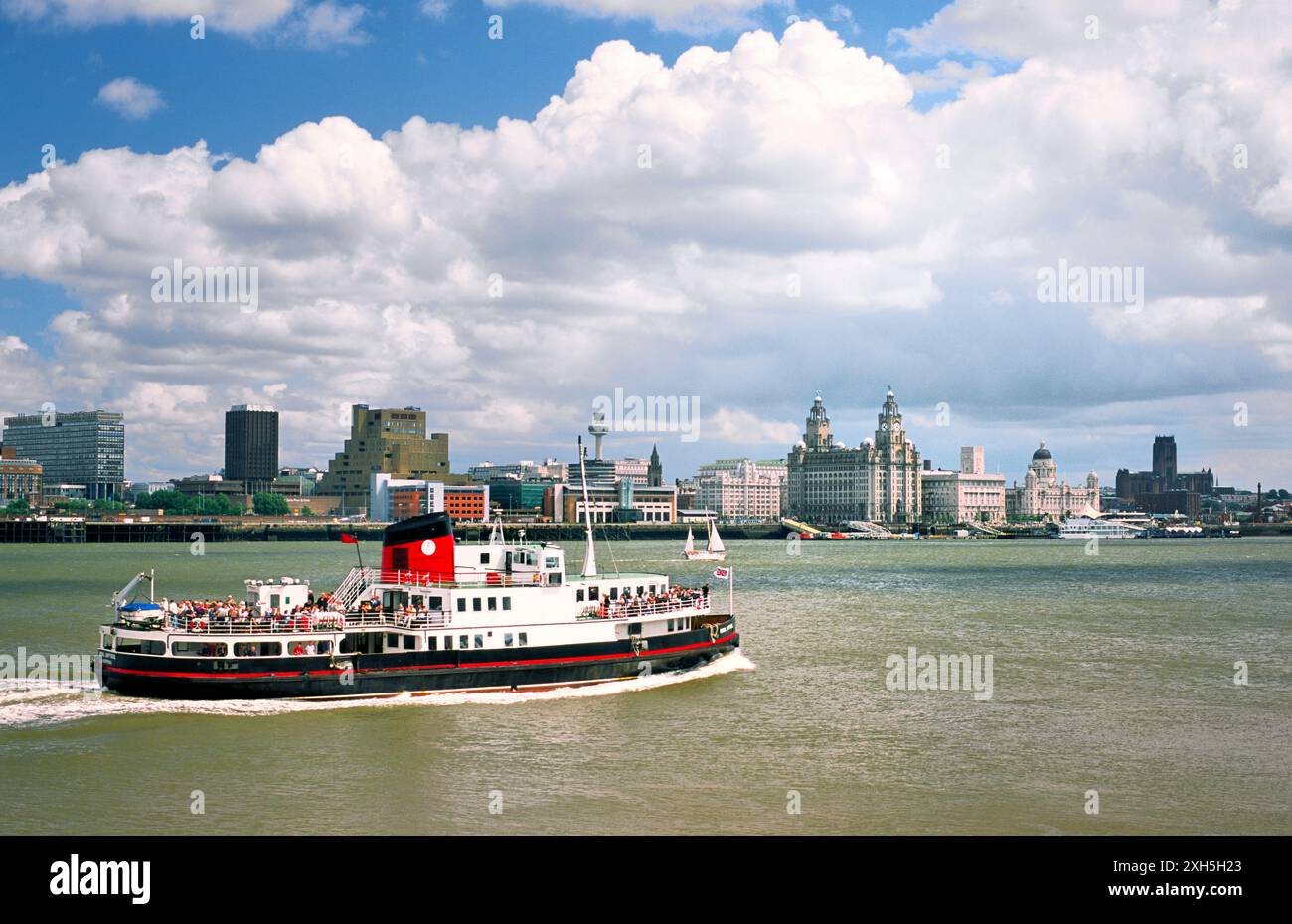 The Liverpool Ferry crossing the River Mersey with the Three Graces ...