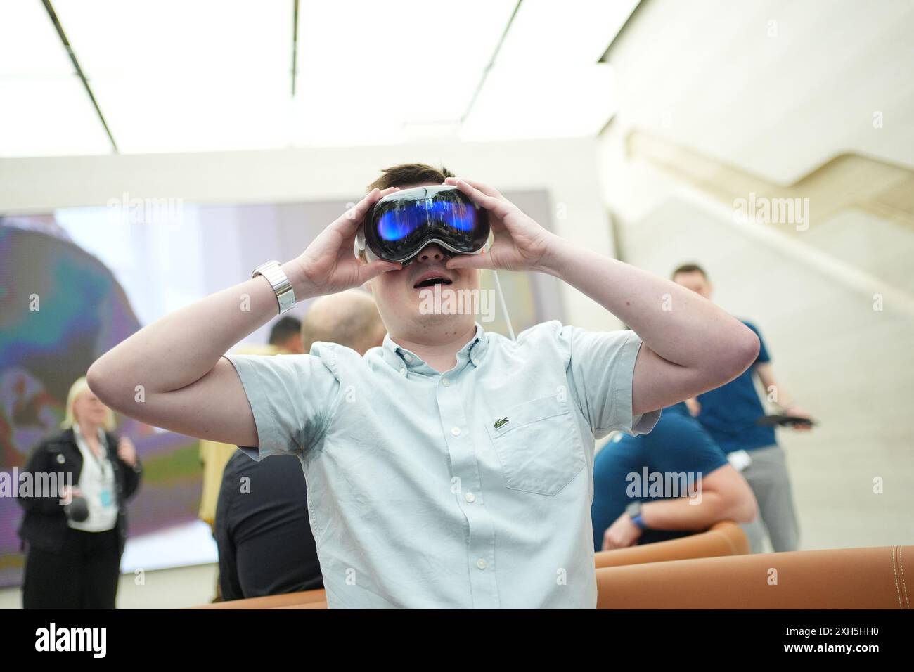 Software engineer Liam Nicholson, 27, from London, tries the new Apple ...