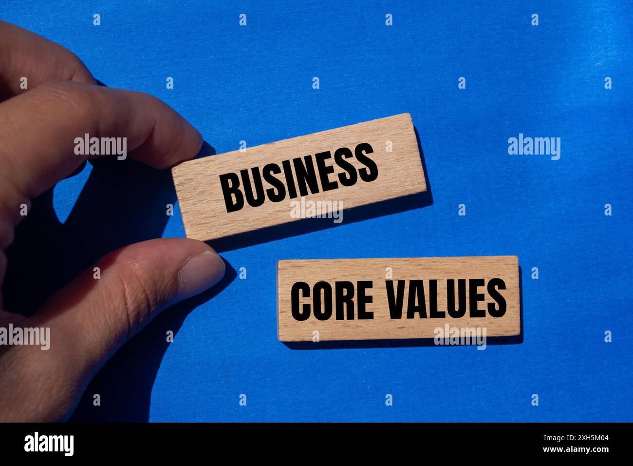 Business core values message written on wooden blocks with blue ...