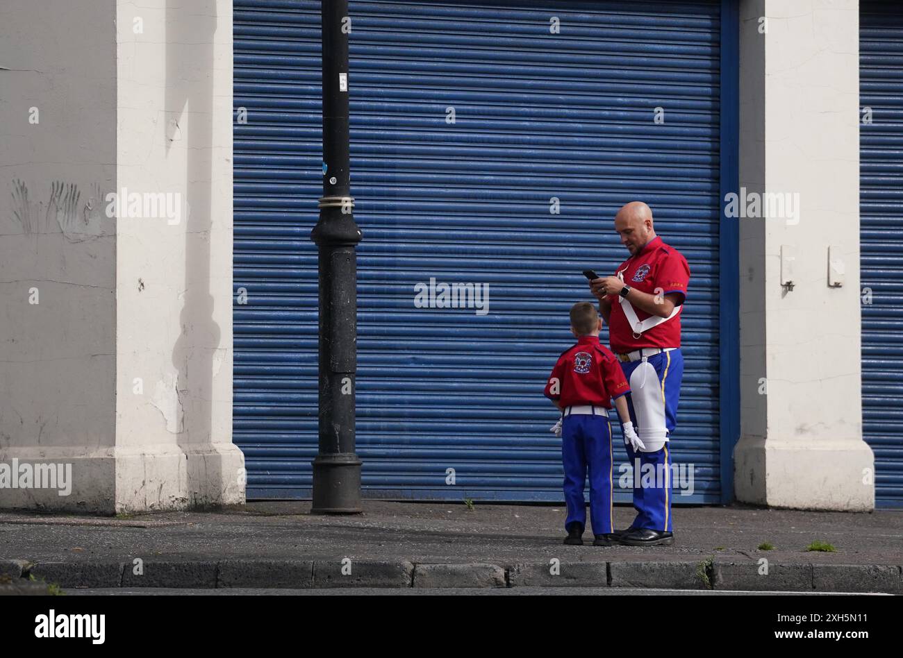 People gather at Carlisle Circus in Belfast ahead of an Orange Order ...
