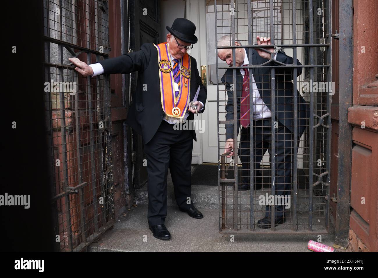 Orange Order members open the gates to the Belfast Orange Hall on ...