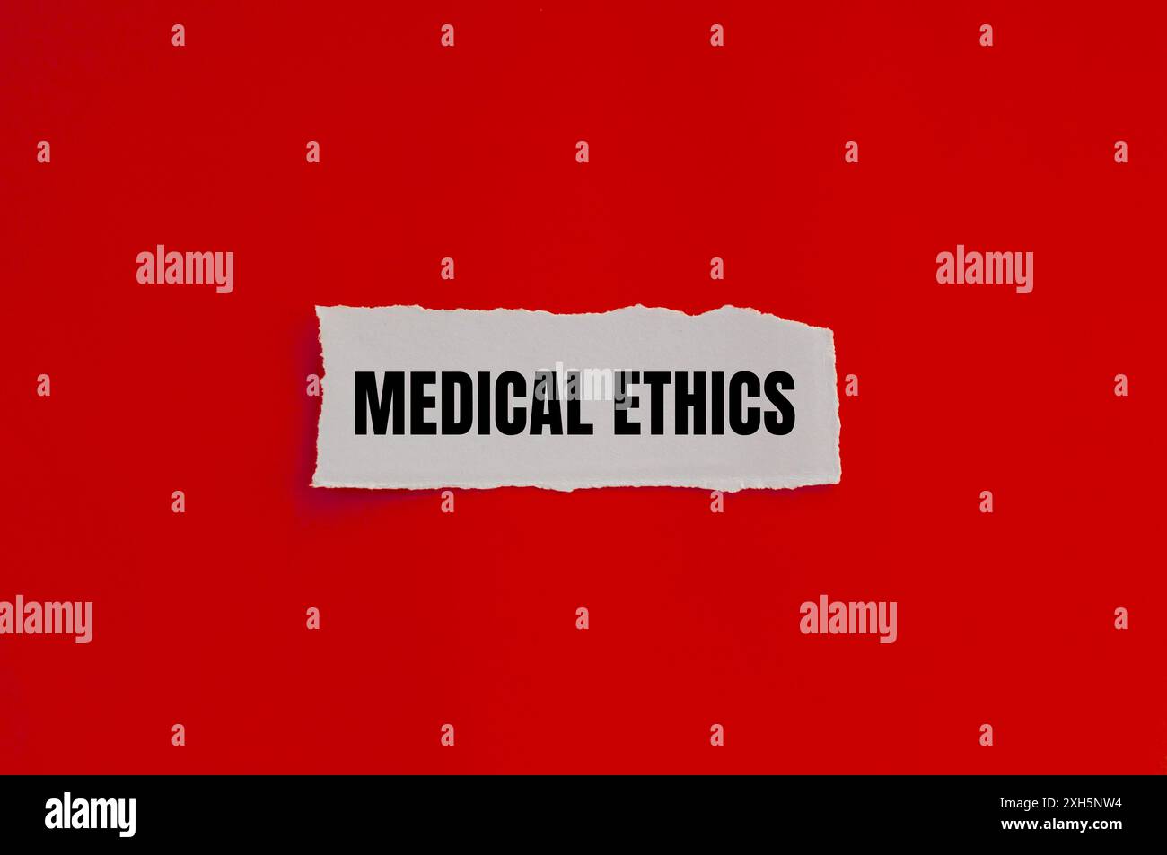 Medical ethics message written on ripped torn paper piece with red ...