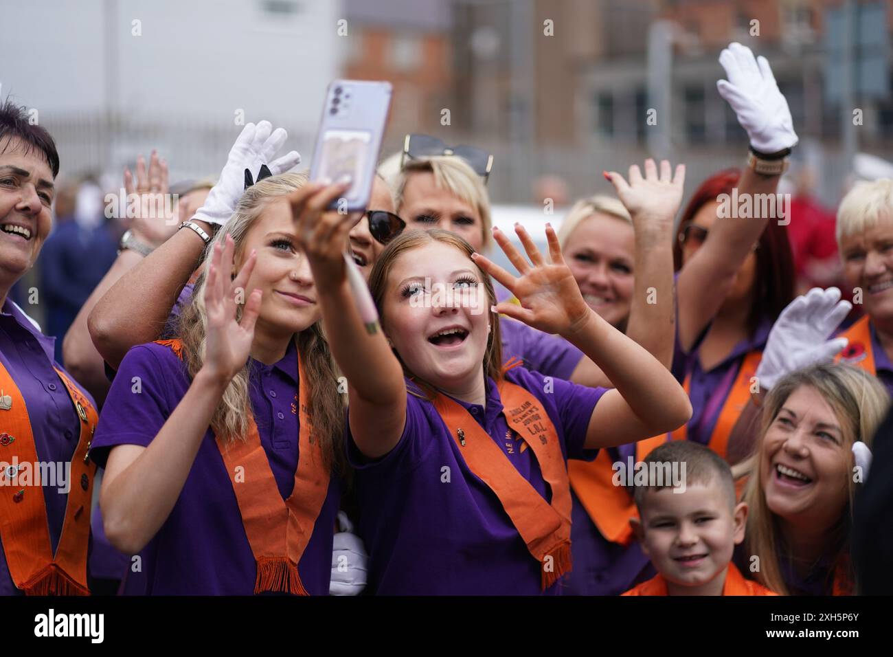 People gather at Carlisle Circus in Belfast ahead of an Orange Order ...