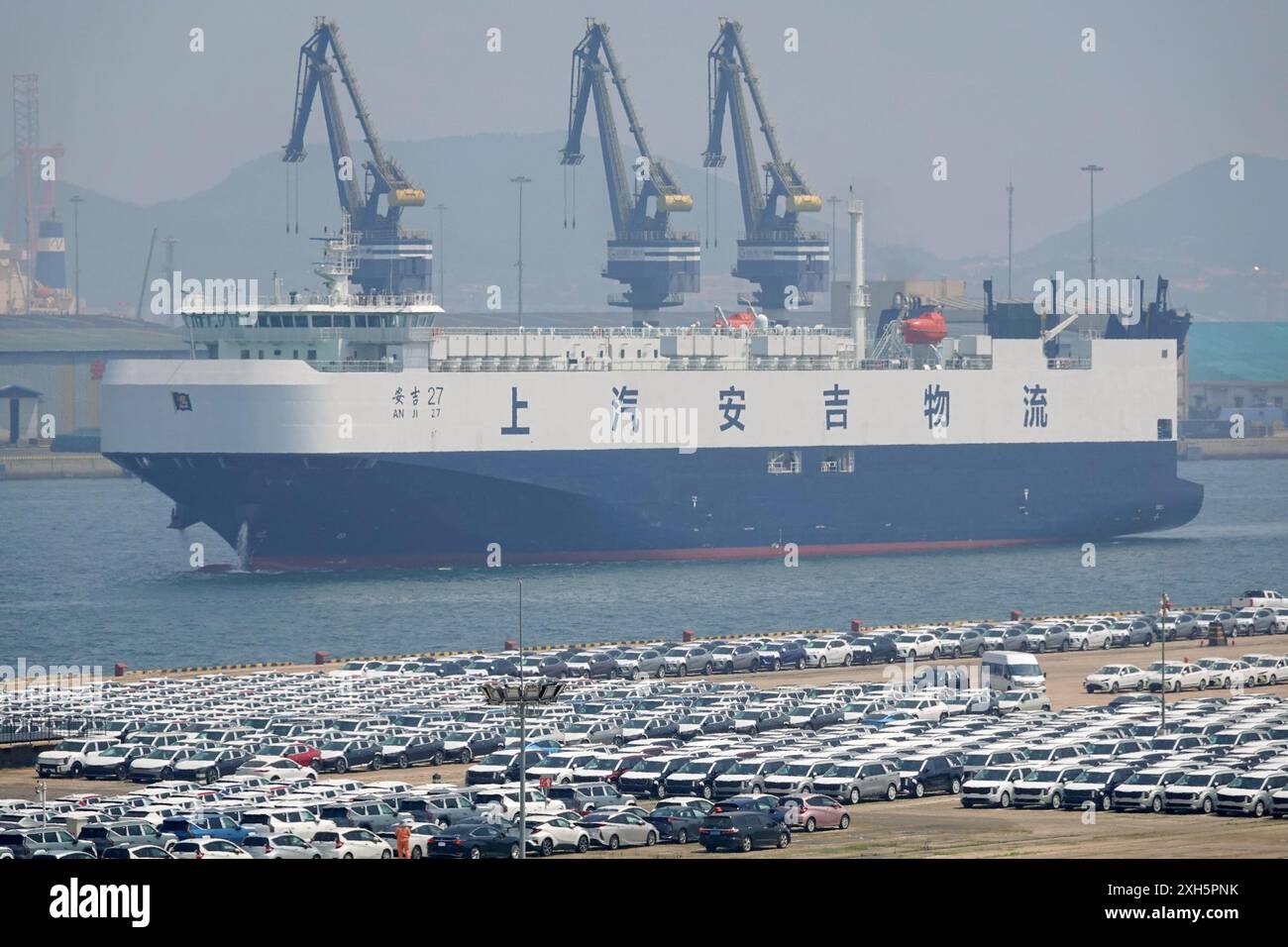 YANTAI, CHINA - JULY 12, 2024 - Chinese vehiclers are exported via a ...