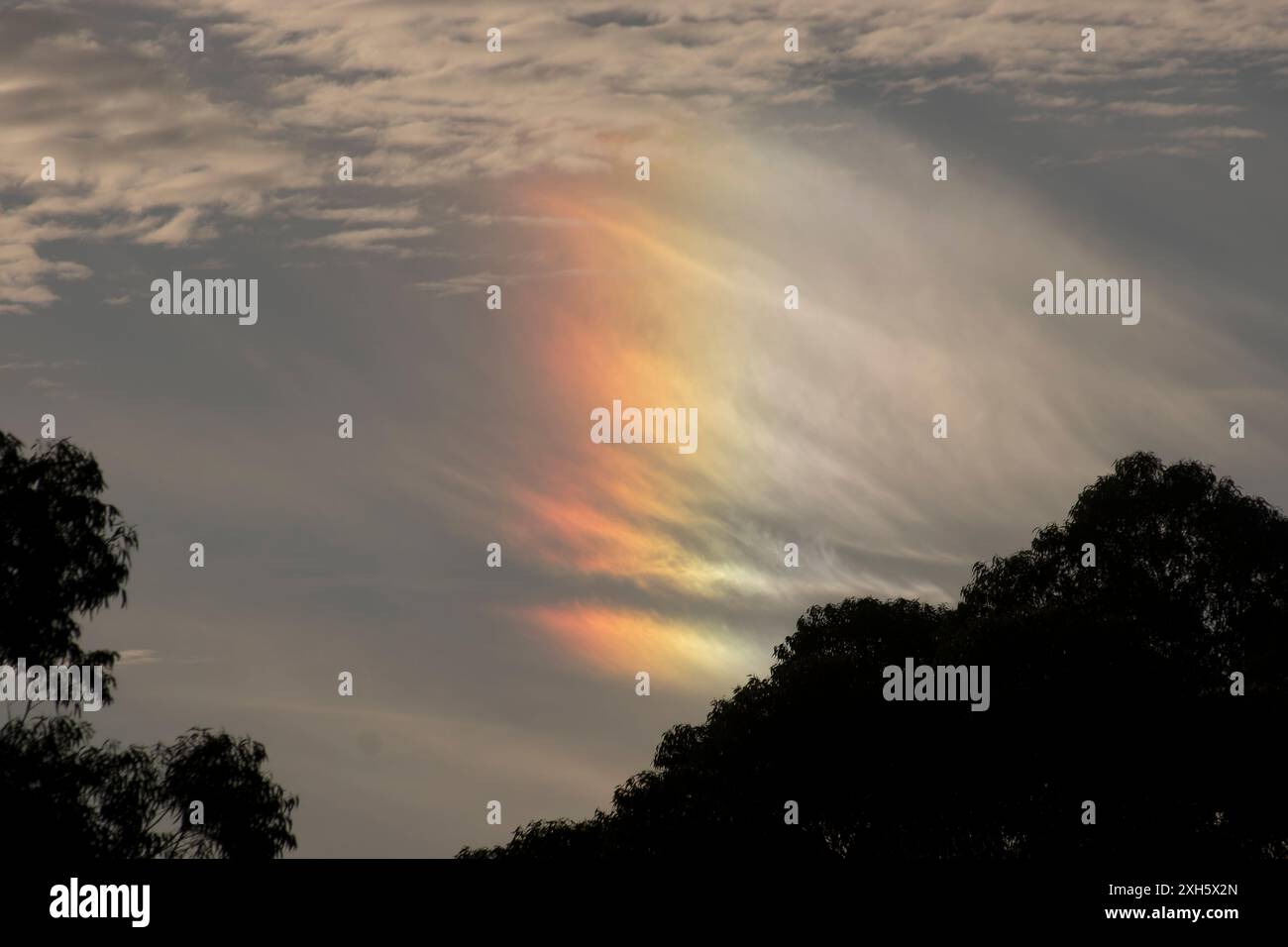 Rainbow colours in clouds hi-res stock photography and images - Alamy