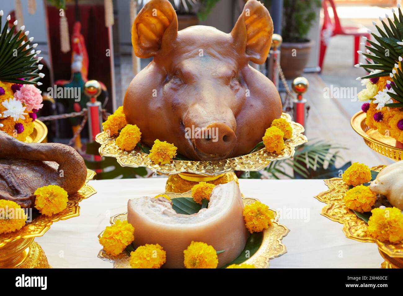 Pig’s head for offerings to pay respect god Stock Photo - Alamy