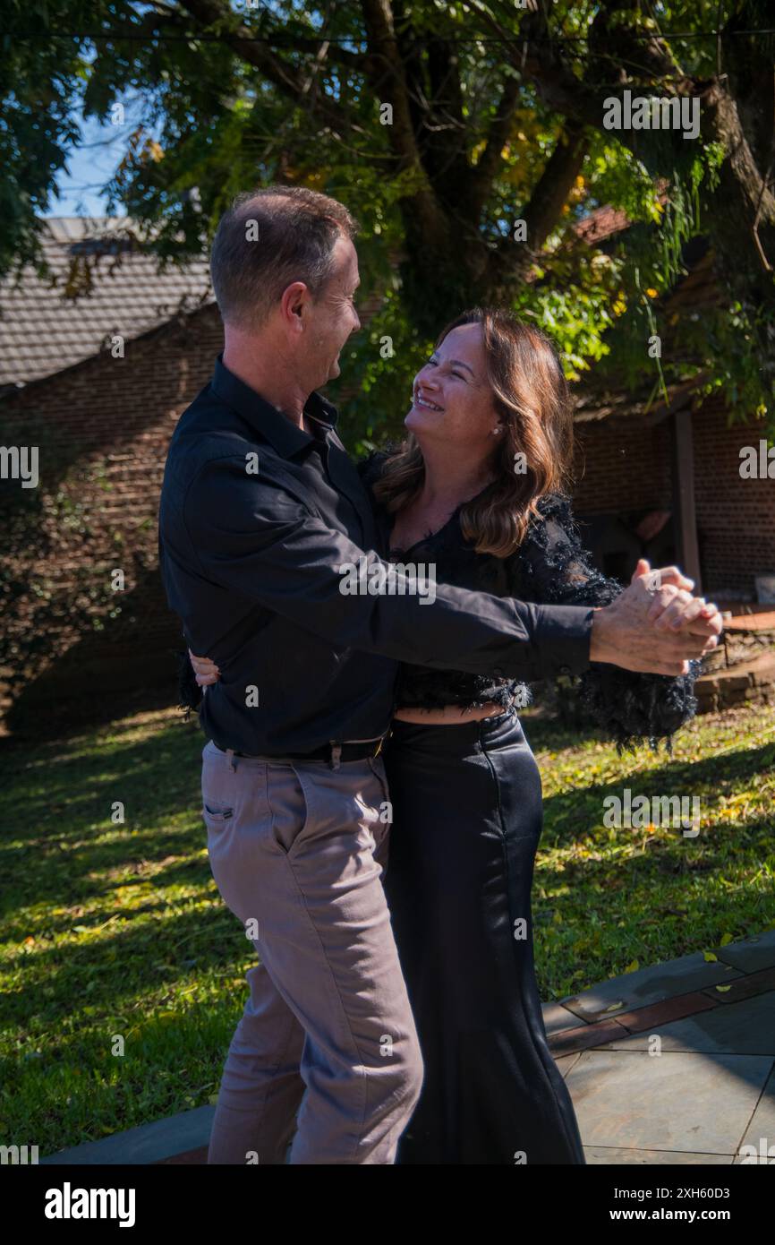 Middle age couple dancing together Stock Photo - Alamy