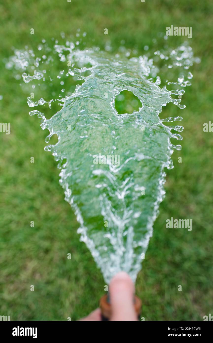 Spray water from hose clean hi-res stock photography and images - Alamy