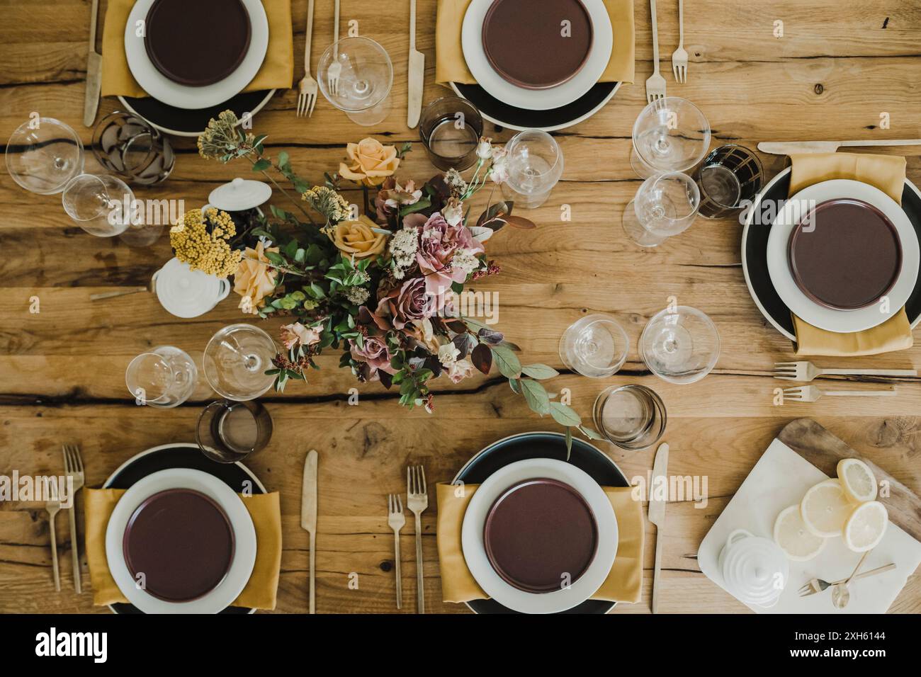 Elegant table setting with floral centerpiece and place settings Stock ...