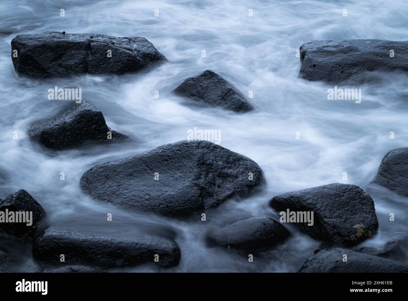 Dark black coastal rocks hi-res stock photography and images - Alamy