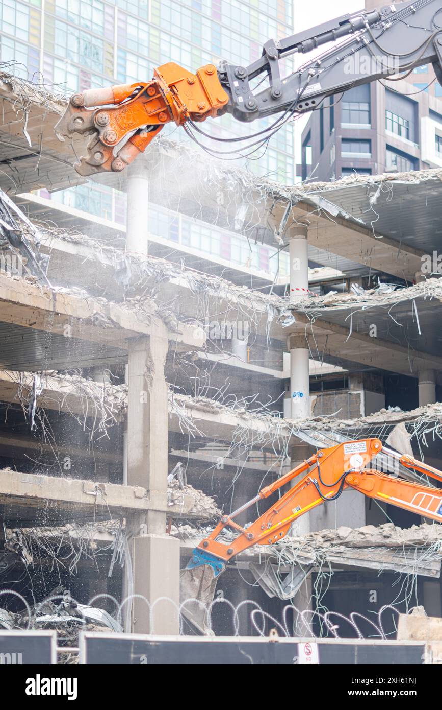 Urban renewal project excavator demolishing hi-res stock photography ...