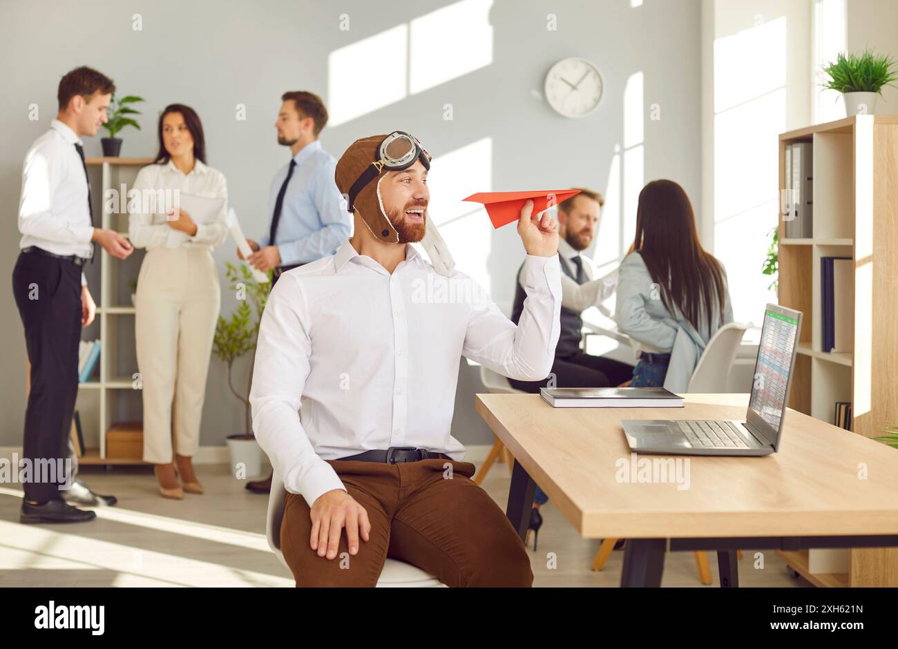 Man launching paper airplane on hi-res stock photography and images - Alamy