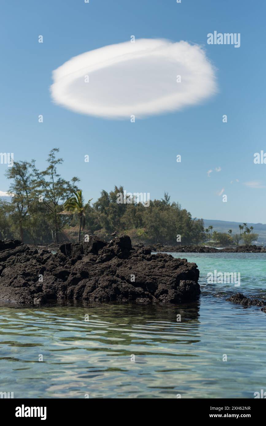 Lens-shaped lenticular cloud formation on sunny day in Hilo, Hawaii ...