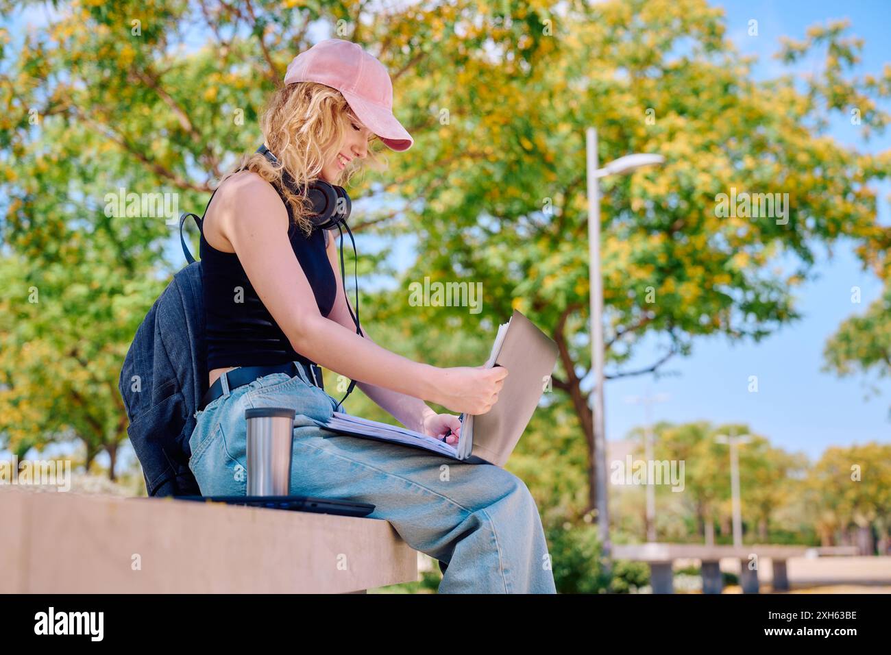 Student working on laptop outside Stock Photo - Alamy