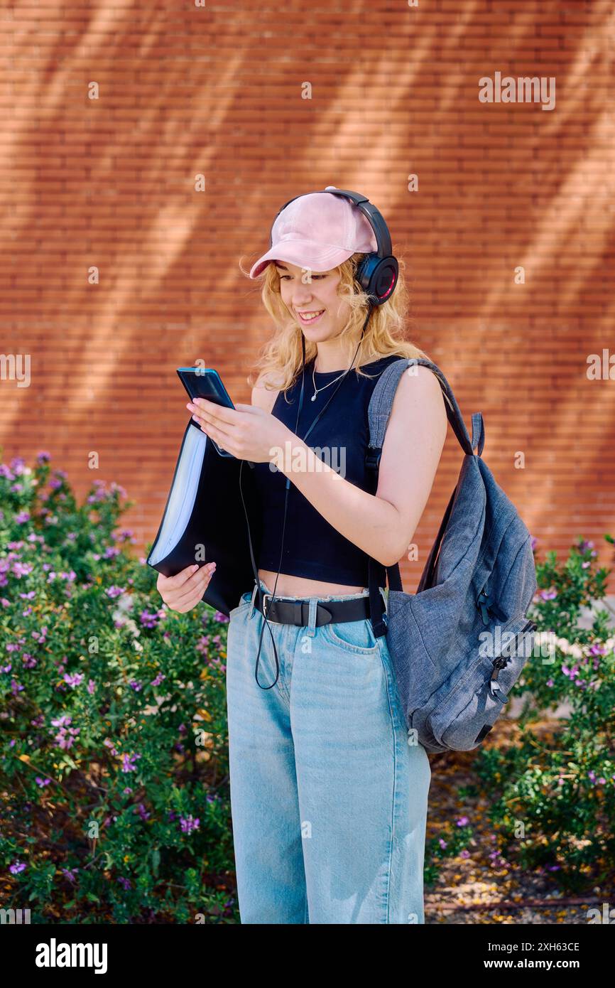 Beautiful woman headphones uses phone hi-res stock photography and ...