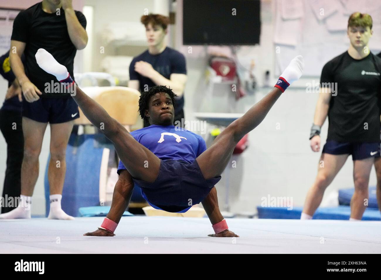 University of Michigan gymnast Fred Richard stretches, Monday, Jan. 29 ...