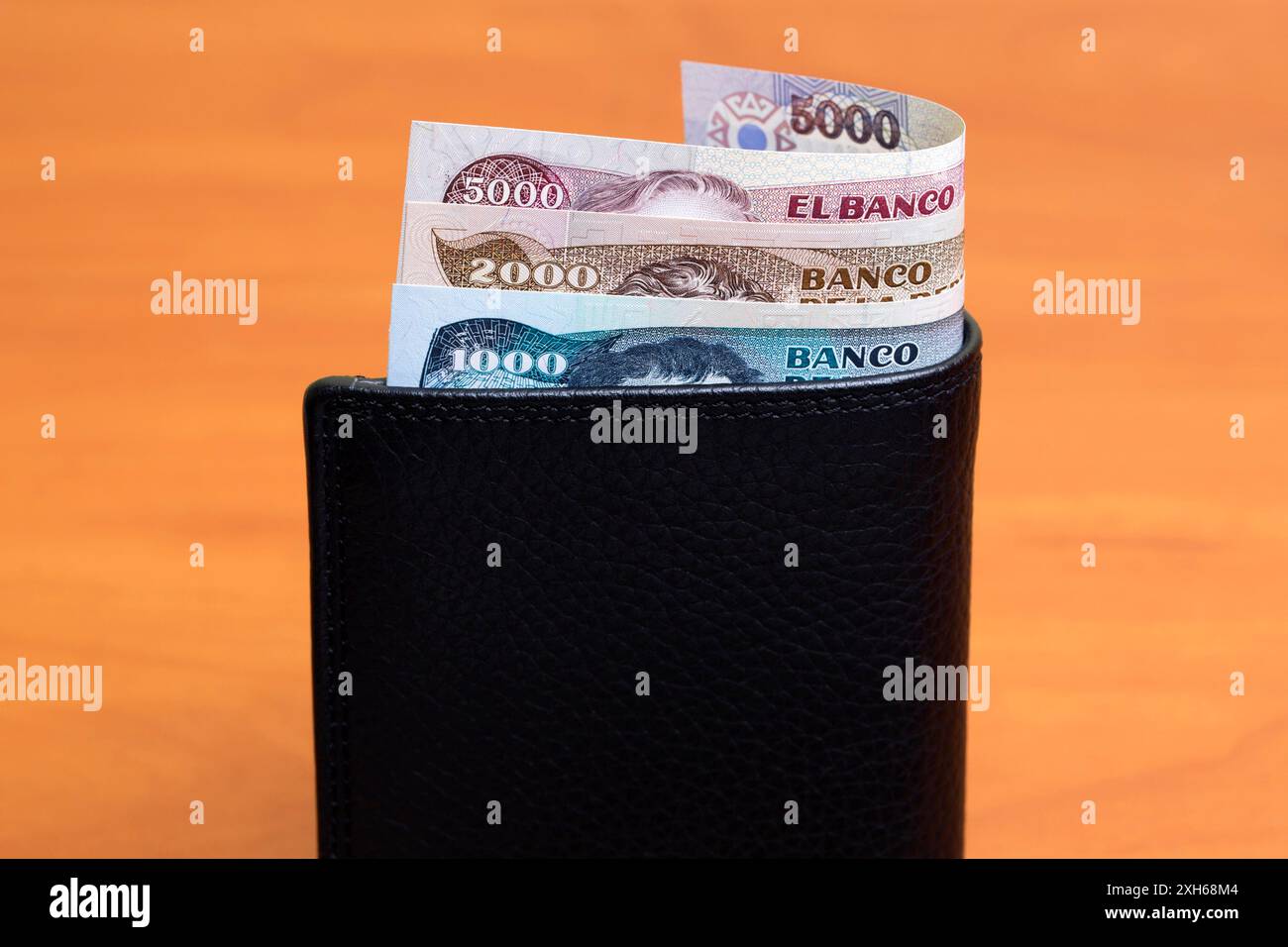 Colombian money - Pesos in the black wallet Stock Photo - Alamy
