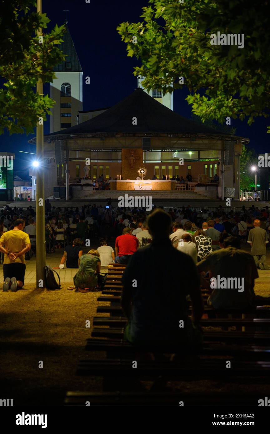 Pilgrims adoring Jesus Christ present in the Blessed Sacrament after ...