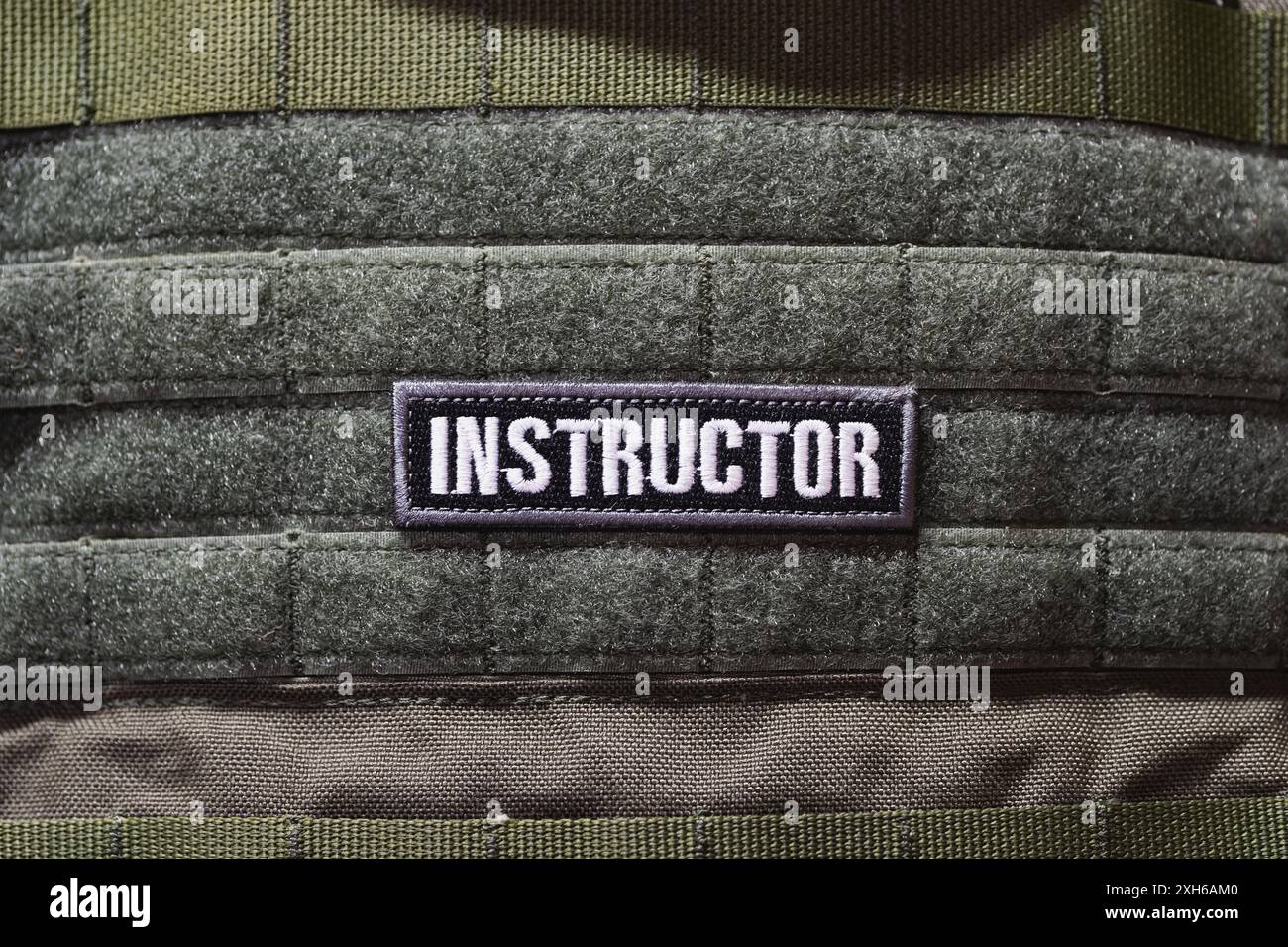 Patch with the inscription instructor on the tactical vest molle plate carrier green Stock Photo ...