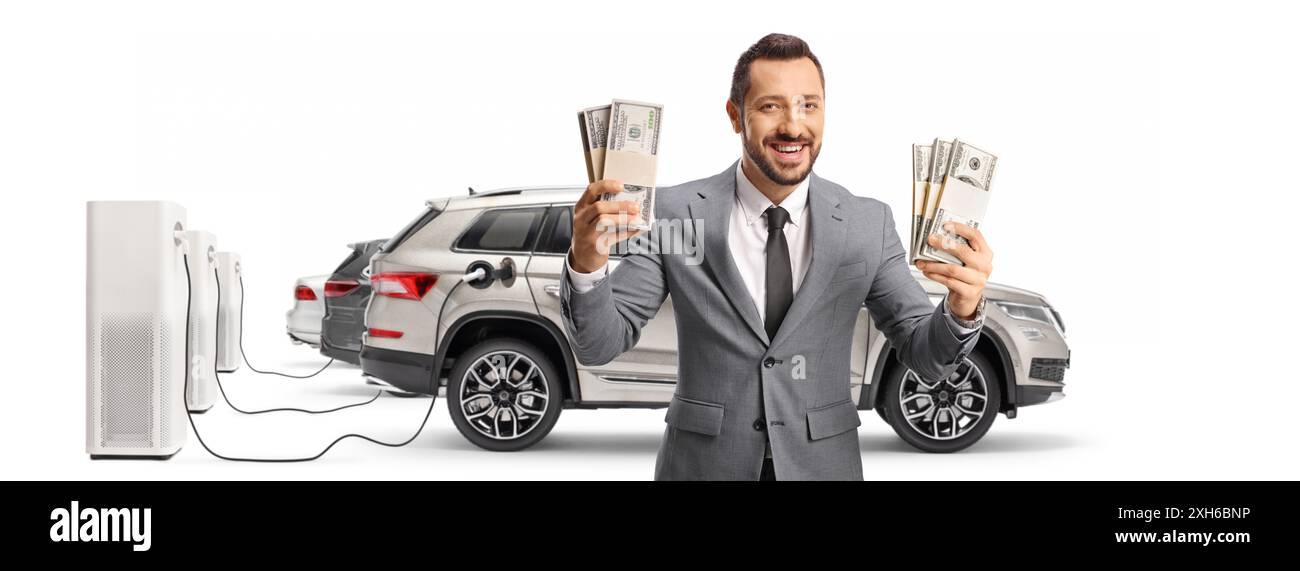 Businessman holding money at EV charging station isolated on white ...