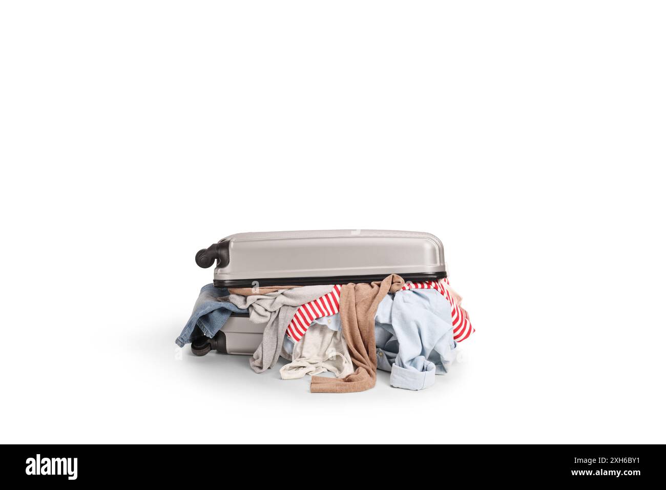 Packed suitcase with messy clothes isolated on white background Stock ...
