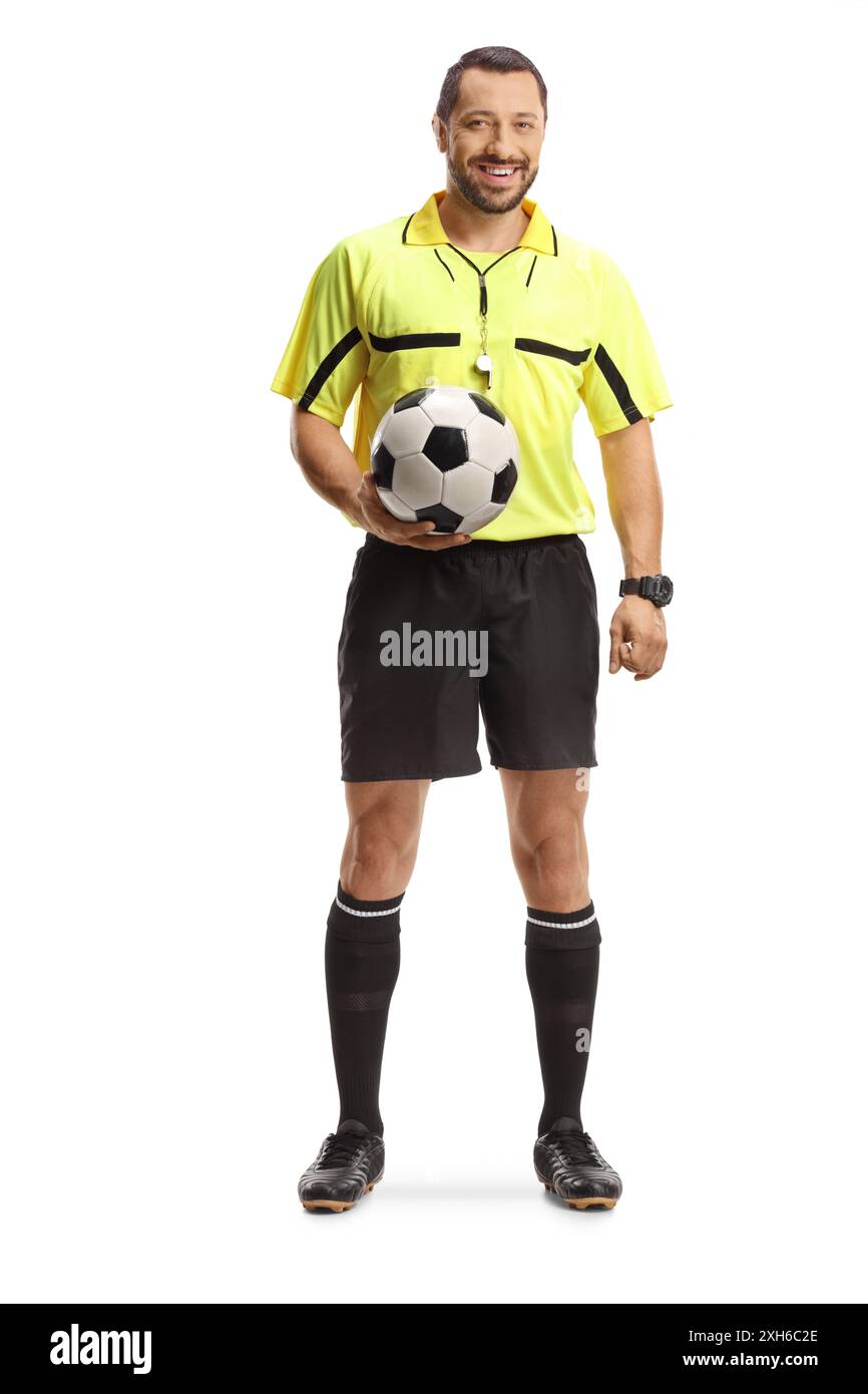 Football referee holding a ball and smiling isolated on white ...