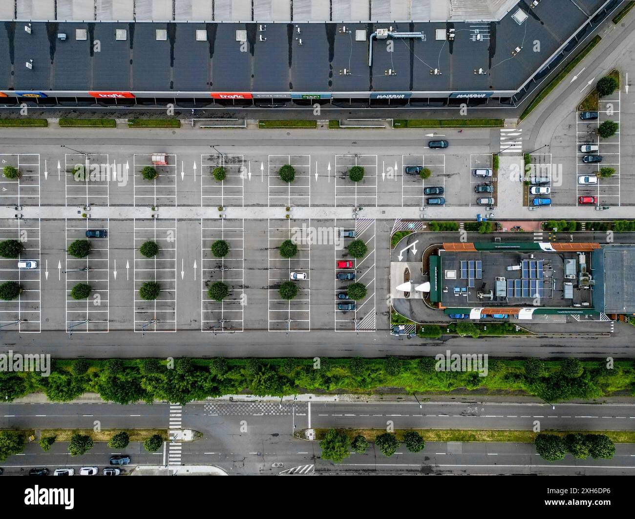 An aerial photograph captures an unoccupied parking lot, encircled by ...