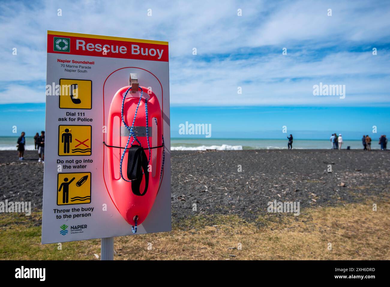 A rescue buoy flotation device beside the black sands beach at Napier ...