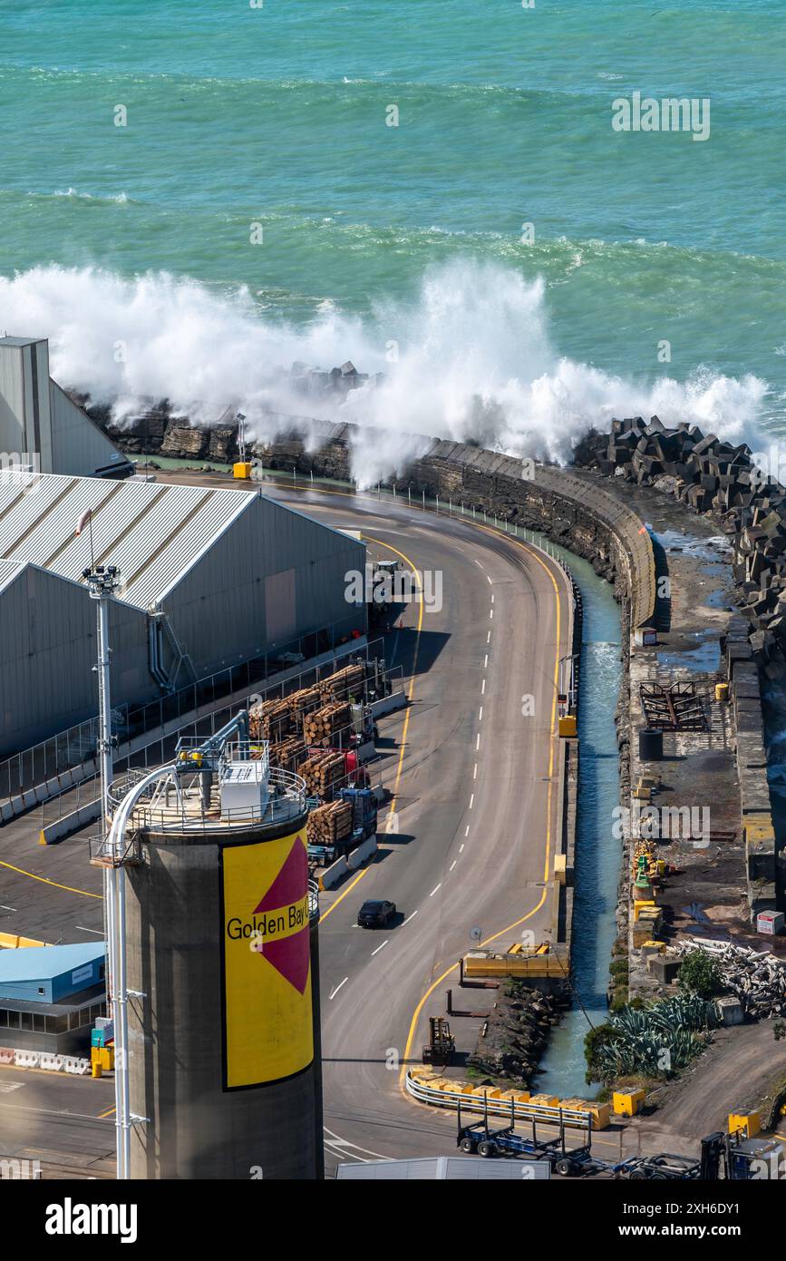 Ocean waves smash into and over the seawall breakwater at the Port of ...