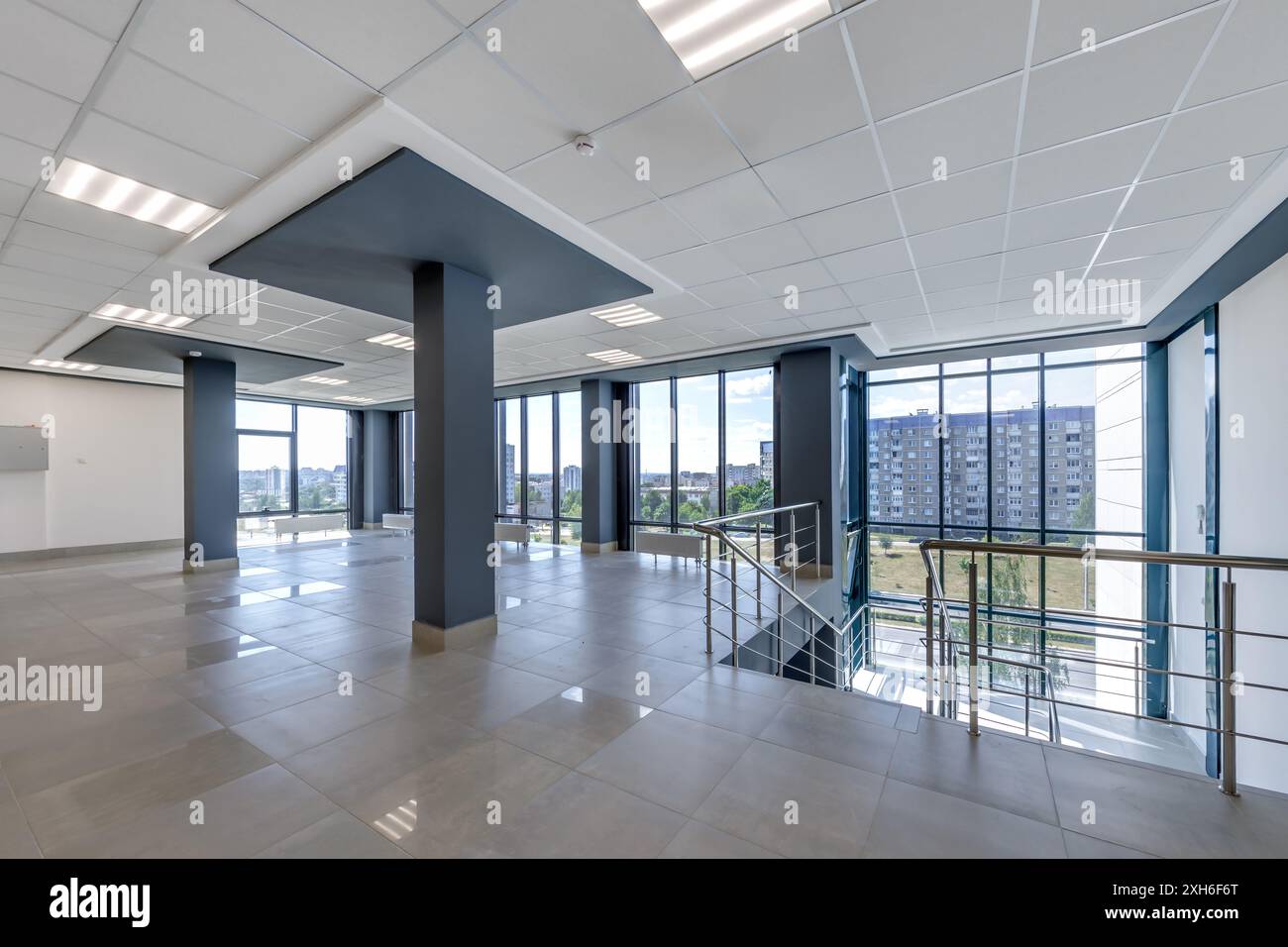panorama view in empty modern hall with columns, doors and panoramic ...