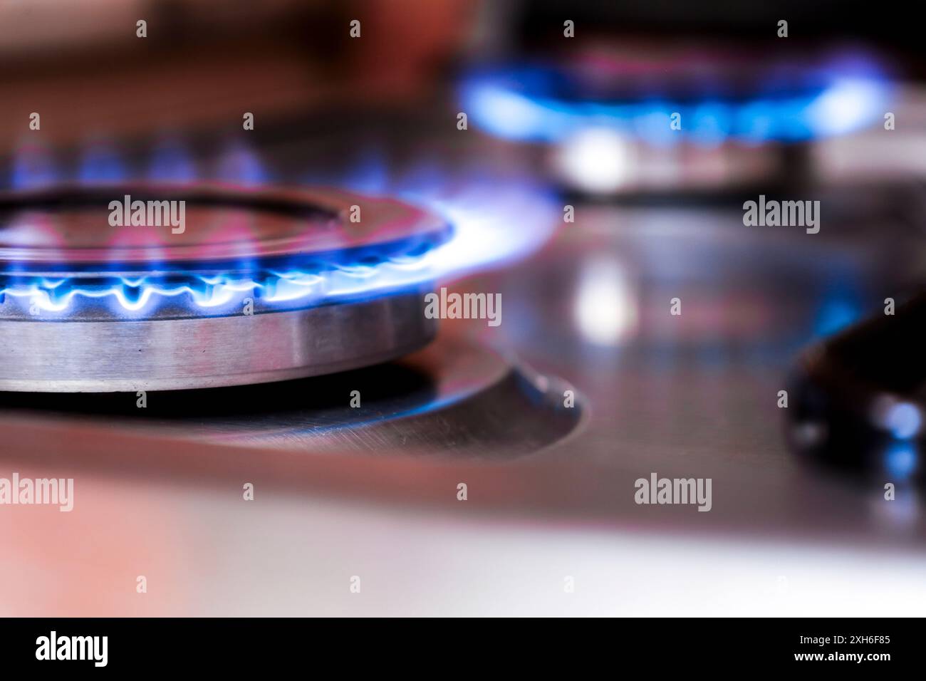 Gas flame on a hob on a stainless steel kitchen Stock Photo - Alamy