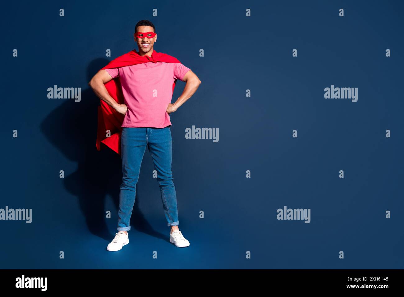 Full length body photo of young superman guy in red face mask and cape ...