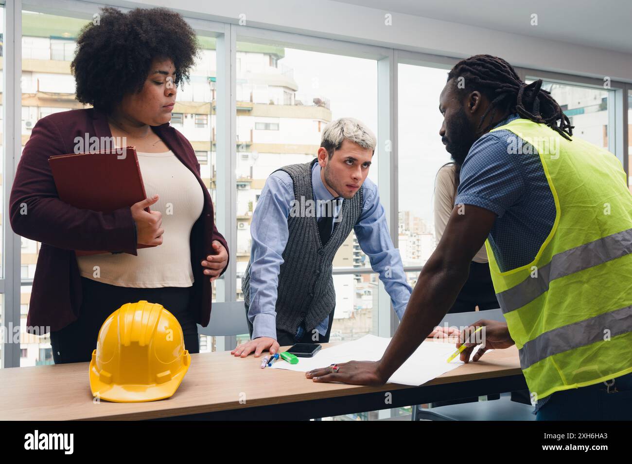 Adult African Man with dreadlocks and reflective clothing is standing ...