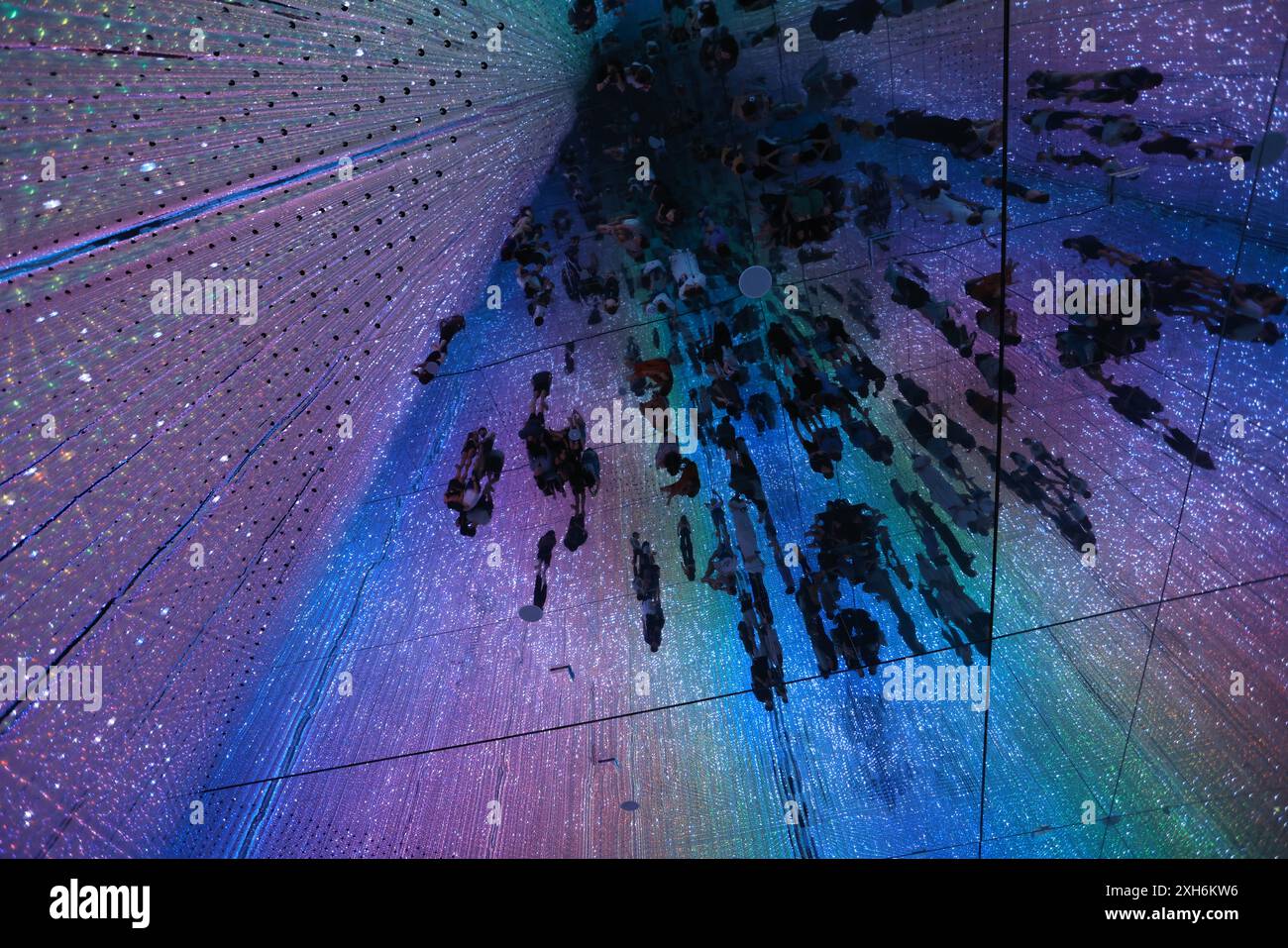 people experience the light show in teamLab Planets at Odaiba. it is ...