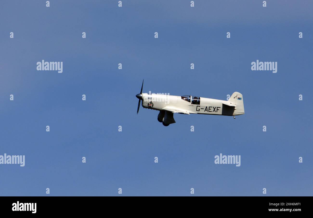 1936 Percival Mew Gull G-AEXF Aircraft in flight with blue sky and ...