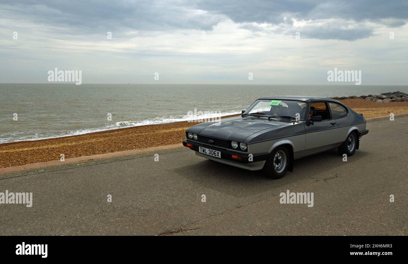 Classic Grey and Silver Ford Capri being driven along seafront ...