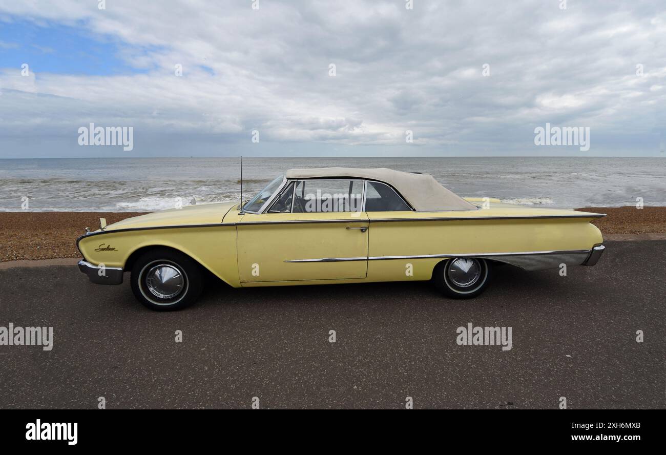 Classic Yellow Ford Galaxie Sunliner motor car parked on seafront ...