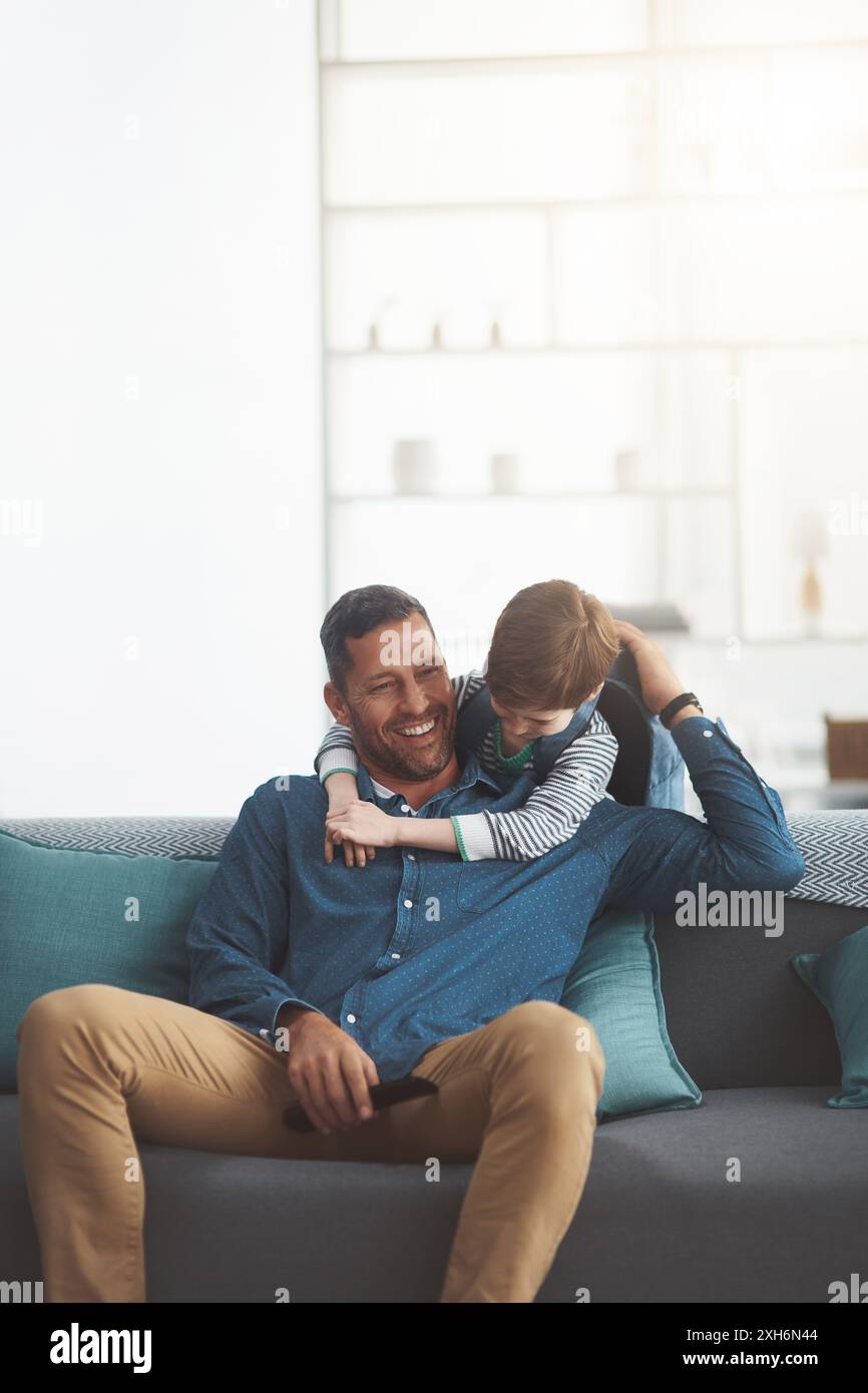 Father, boy and laughing together in hug, bonding and home for back to ...