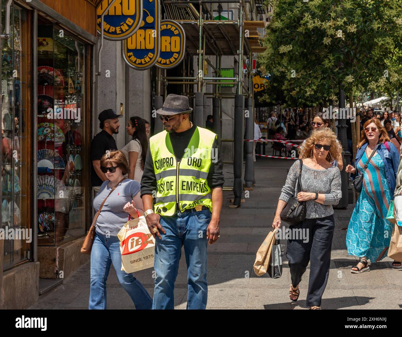 06.19.2024, Madrid, Spain: Man wearing hat and high vis vest ...