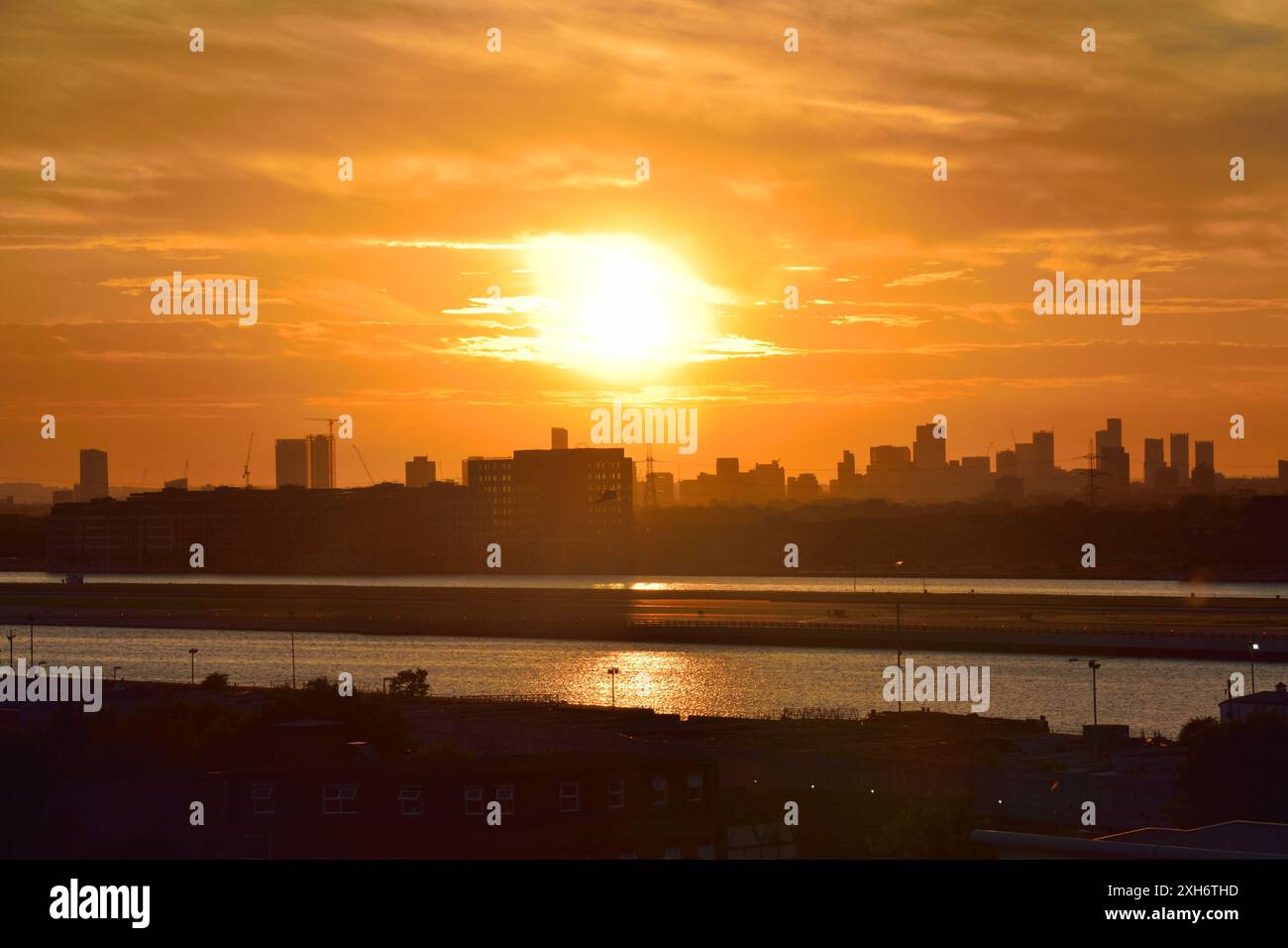 Royal Docks Simmer sunset - a view looking North across Newham towards ...